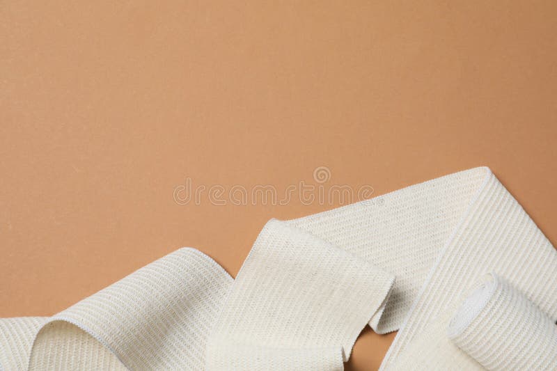 Help during an Injury, Elastic Bandage on Beige Background Stock Photo ...