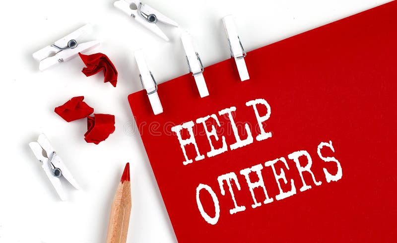 HELP OTHERS Text on Red Paper with Office Tools on White Background ...