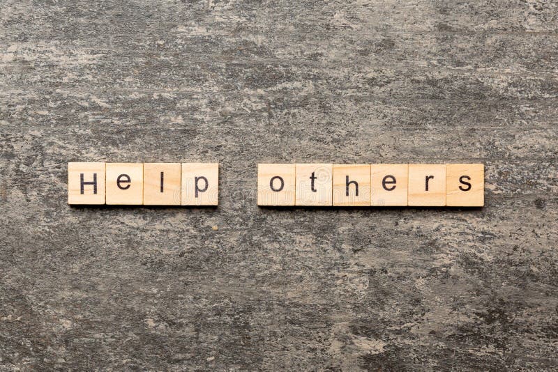 Help Others Word Written on Wood Block. Help Others Text on Table ...