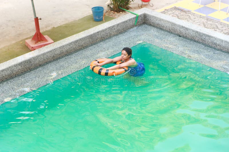 Help at the Pool stock image. Image of blue, pick, boys - 3313871