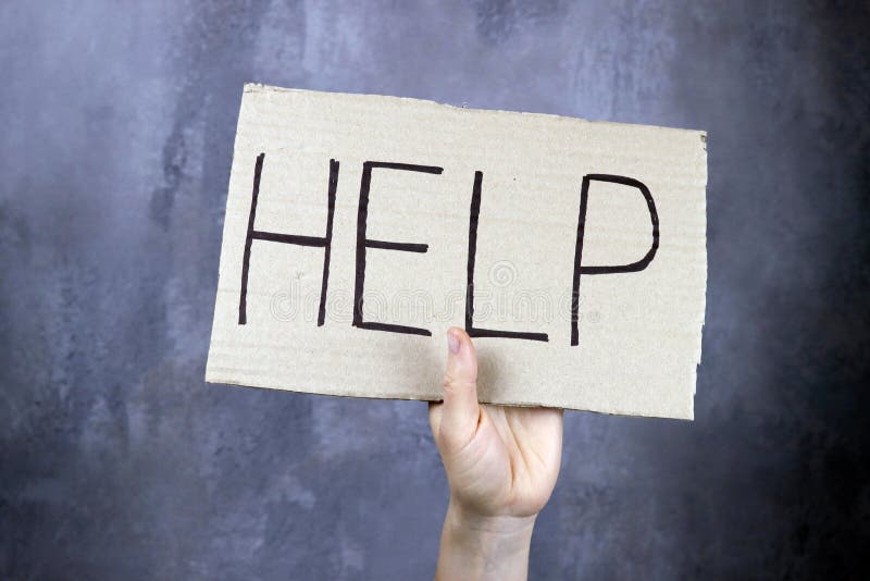 Help Poster Written in Marker in Hand on Gray Background Stock Photo ...