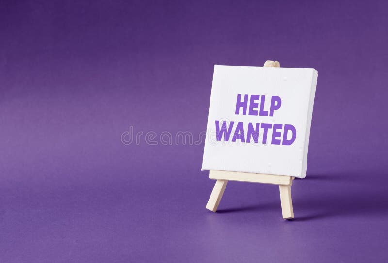 Help Wanted Announcement on an Easel on Purple Background Stock Photo ...