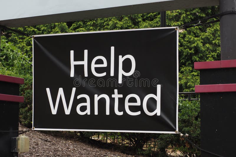 The Help Wanted Sign is Black with White Letters. Stock Image - Image ...