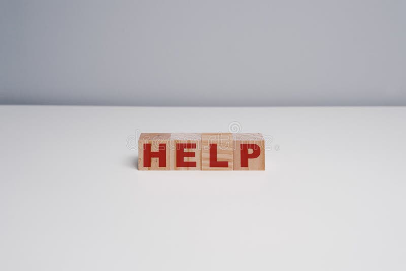 Help Word Written on Cube Shaped Wooden Blocks on a White Colored Table ...