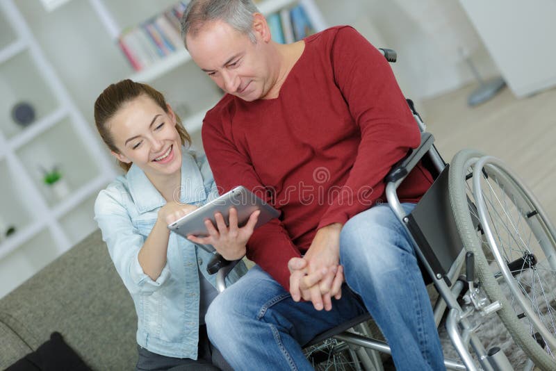 Helper and Senior Man Using Tablet Stock Photo - Image of sitting ...