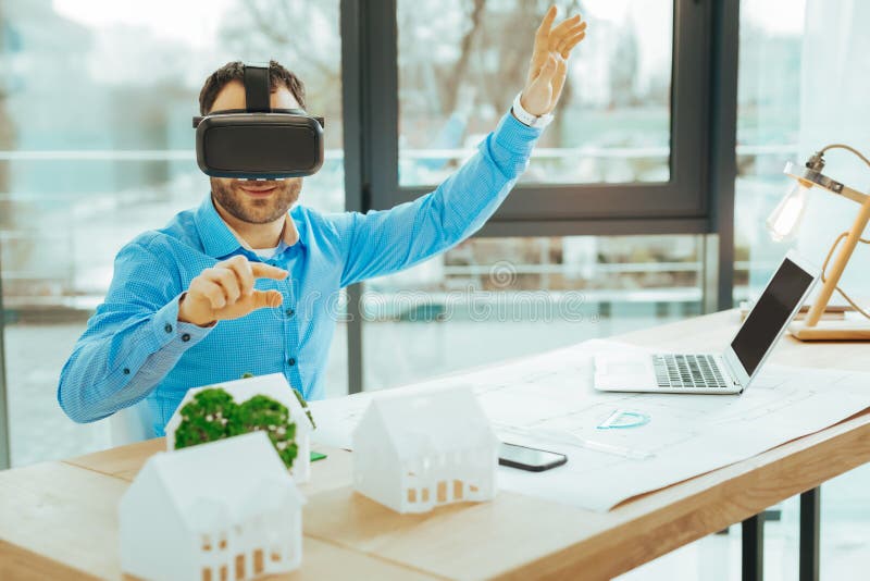 Cheerful Engineer Smiling and Working with Virtual Reality Stock Image ...