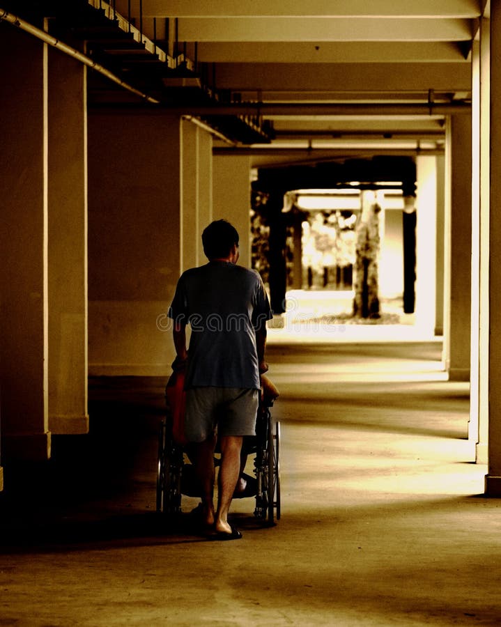 1,135 Man Pushing Wheelchair Photos - Free & Royalty-Free Stock Photos ...