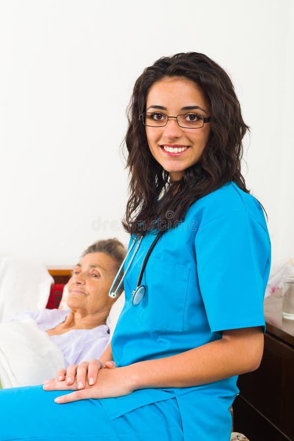 Nurses Caring for Elderly Patients Stock Photo - Image of happiness ...