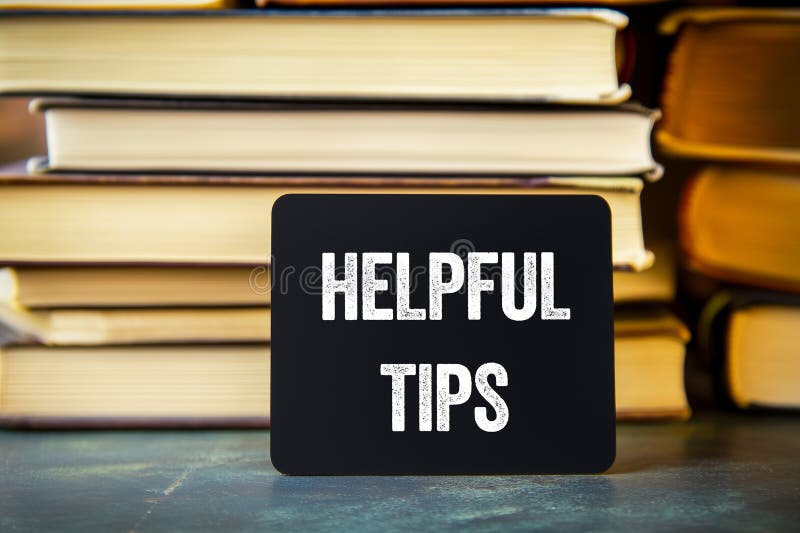 Helpful Tips Message Written on Black Card with Stack of Books Stock ...
