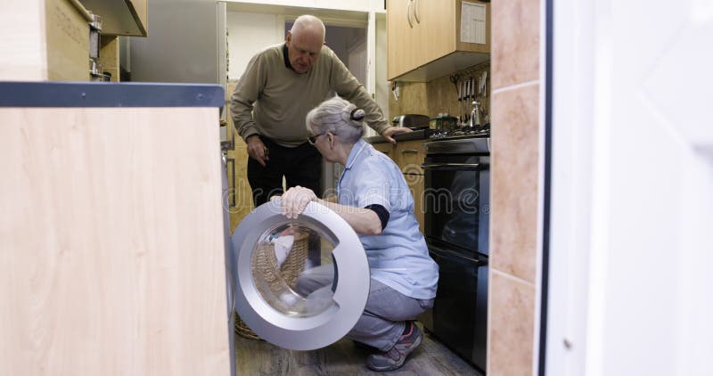 Helping, Cleaning and Senior Couple Doing Laundry, Loading Clothes and ...