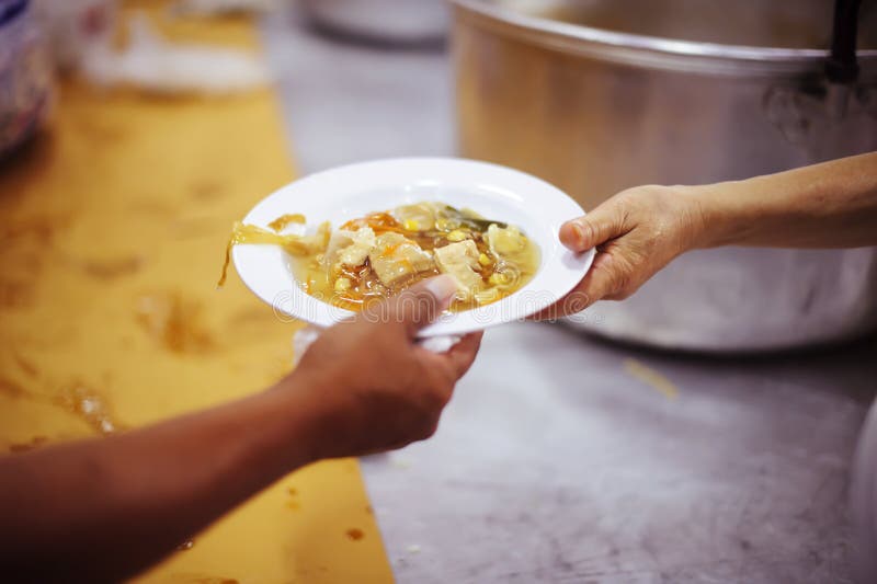 Helping Feed the Poor : the Concept of Hunger Stock Photo - Image of ...
