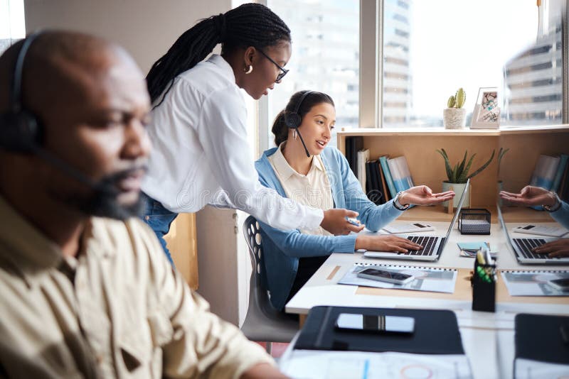 Helping Future Generations Succeed. Two Businesswomen Using a Headset ...