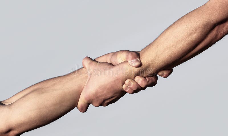 Helping Hand Concept, Support. a Friendly Handshake. Two Hands, Shaking ...