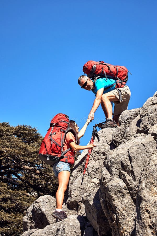 A Helping Hand for a Girl High Mountains in a Hike. Stock Photo - Image ...