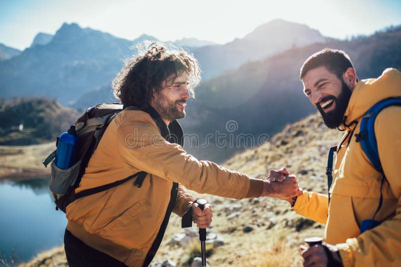 Hiker Man Getting Help on Hike Happy Overcoming Obstacle Stock Image ...