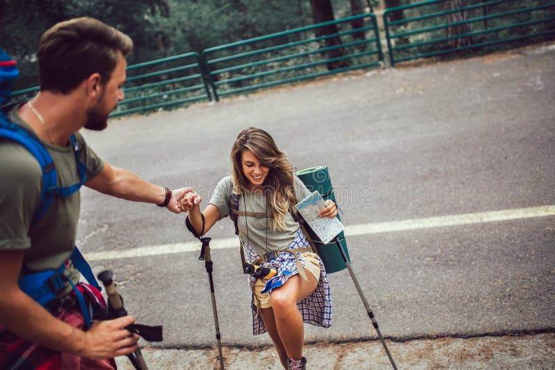 Hiker Woman Getting Help on Hike Smiling Stock Image - Image of active ...