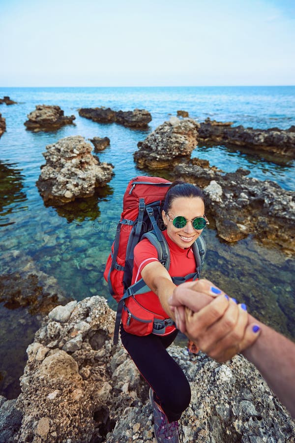Adventure Trek Along the Coast with a Backpack in the Summer Stock ...