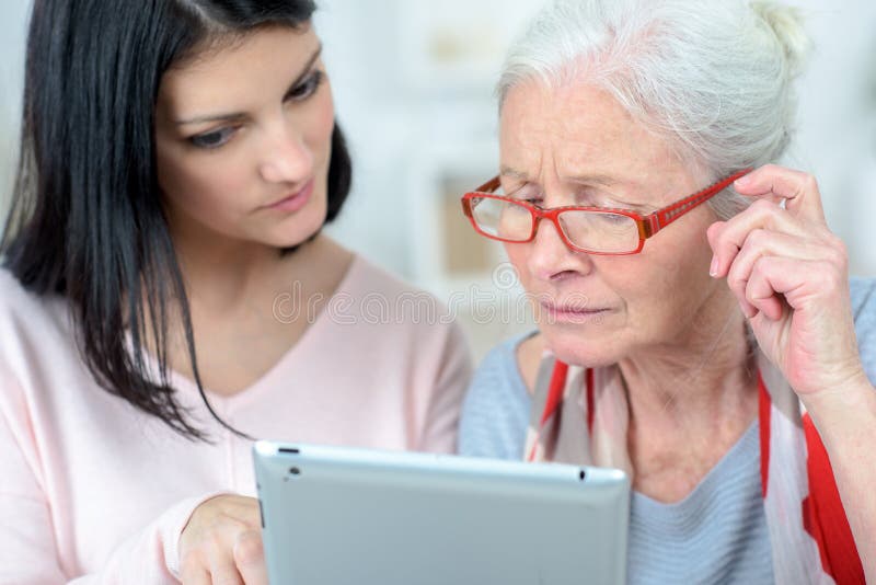 Helping Old Woman Use Tablet Computer Stock Image - Image of tactile ...