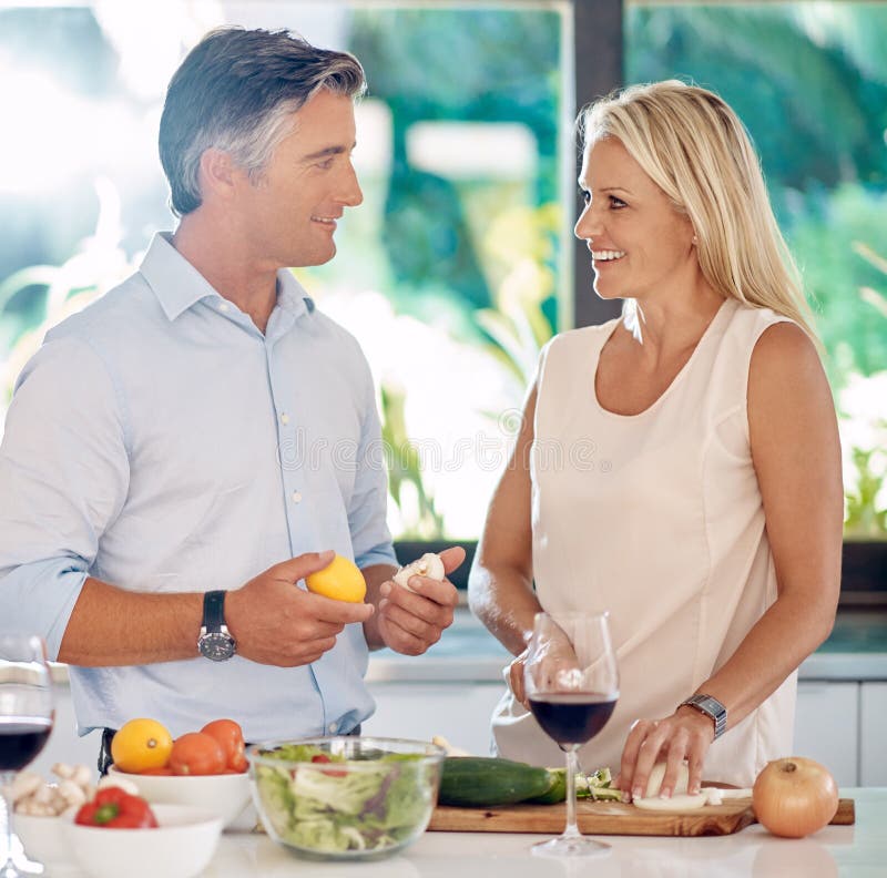 Helping One Another in the Kitchen. an Affectionate Mature Couple ...