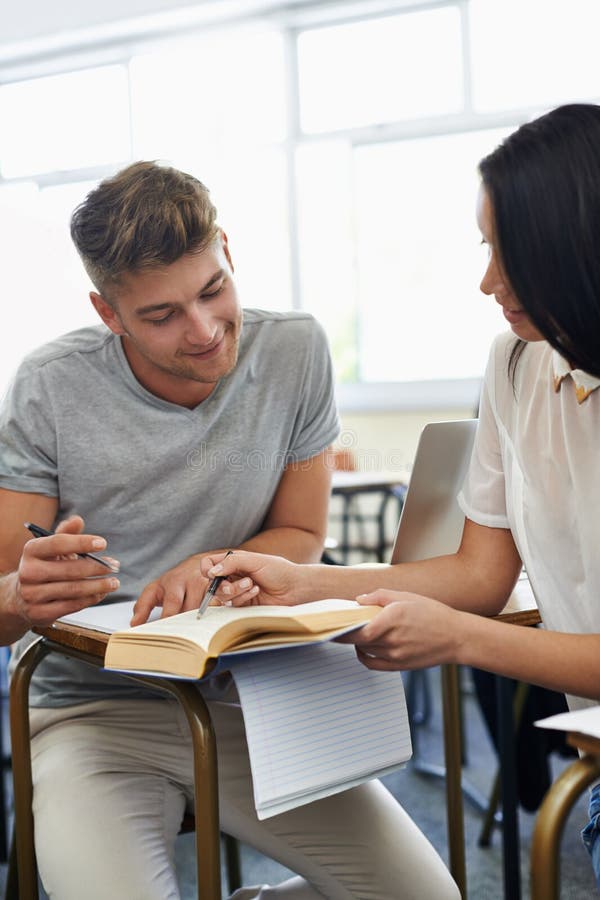Helping Out a Classmate. Two Students Helping Each Other in a Varsity ...