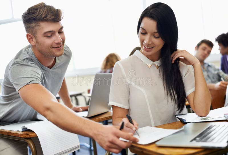 Helping Out a Classmate. Two Students Helping Each Other in a Varsity ...