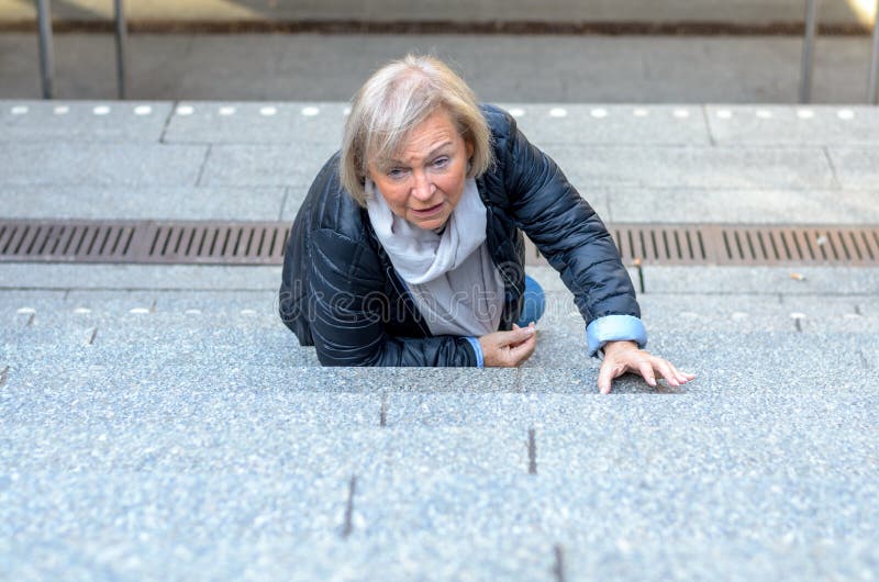 Helpless Senior Woman Falling Down Steps Stock Photo - Image of helping ...