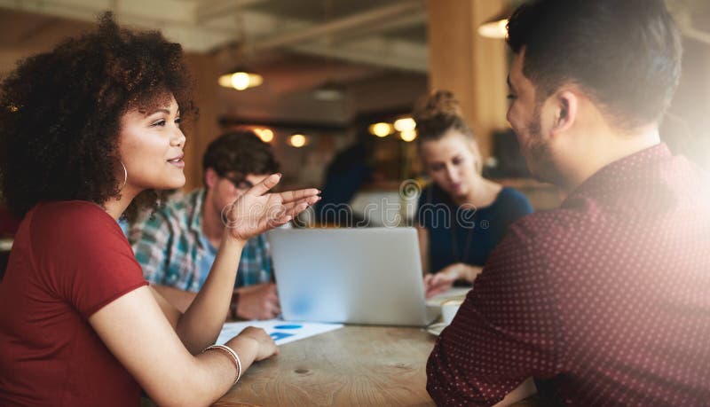 It Helps To Have a Study Partner. Shot of Students Studying in a Coffee ...