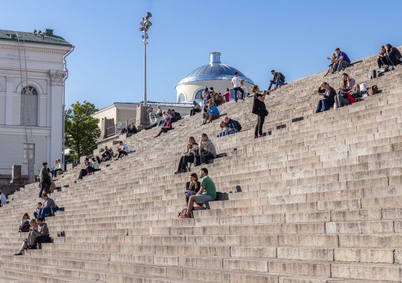 HELSINKI, FINLAND - SEPTEMBER 12, 2015: Resting People on the Granite ...