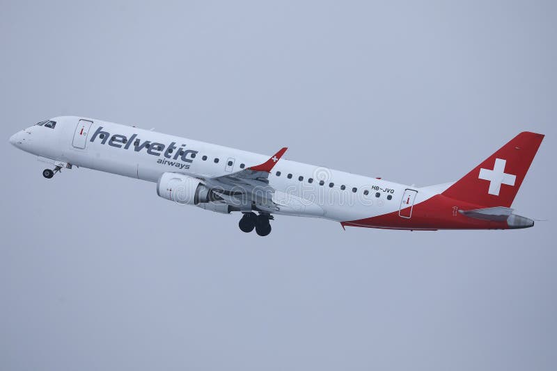 Helvetic Airways Plane Flying Up in the Sky Editorial Photo - Image of ...