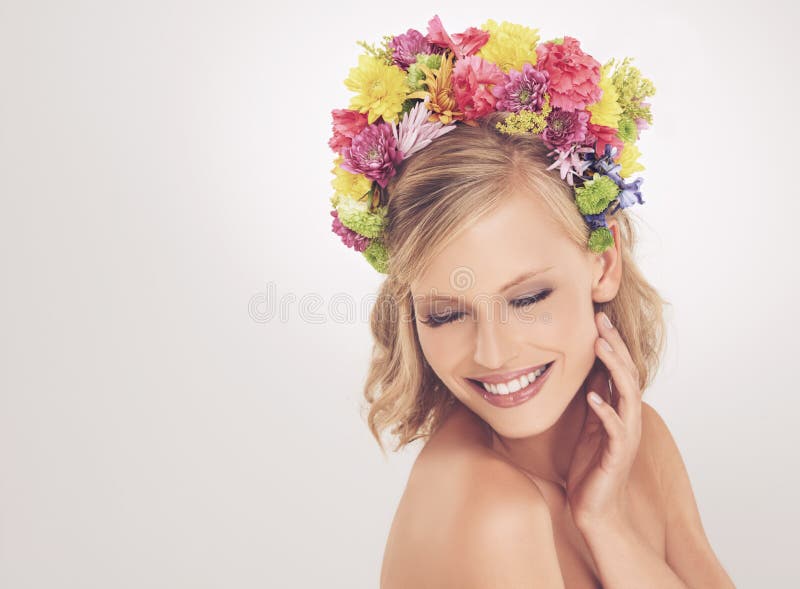 Her Beauty Is True A Young Woman Posing With Her Eyes Shut And Flowers