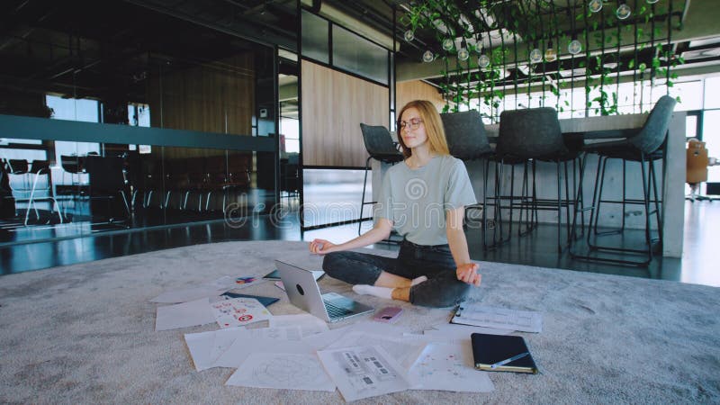 In a Vibrant and Lively Workspace, a Young Woman Takes a Moment To ...