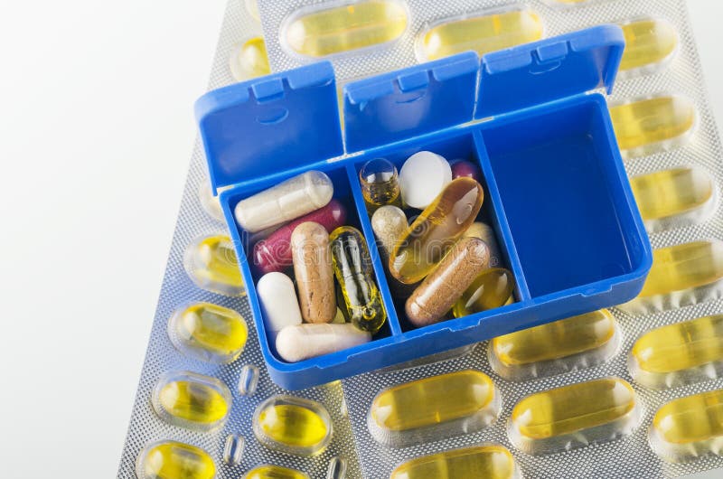 Herbal Capsules and Fish Oil Capsules in Portions Stock Photo - Image ...