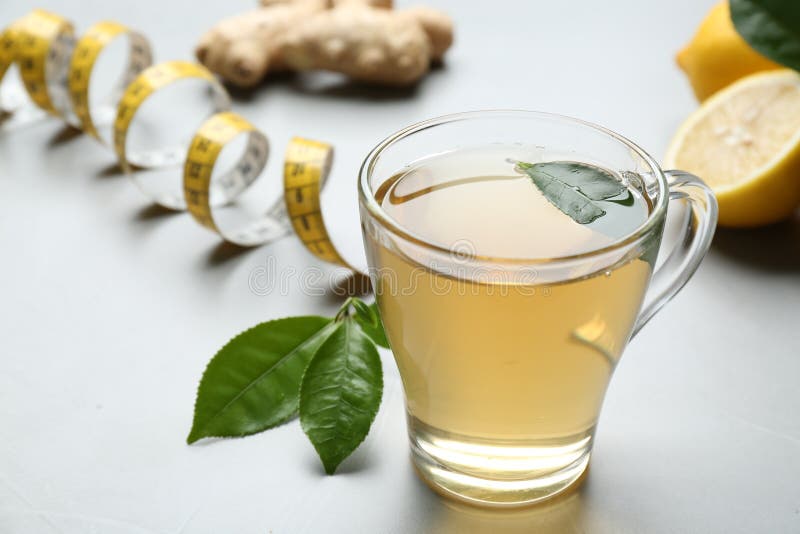 Herbal Diet Tea, Lemon, Ginger and Measuring Tape on Table Stock Image ...