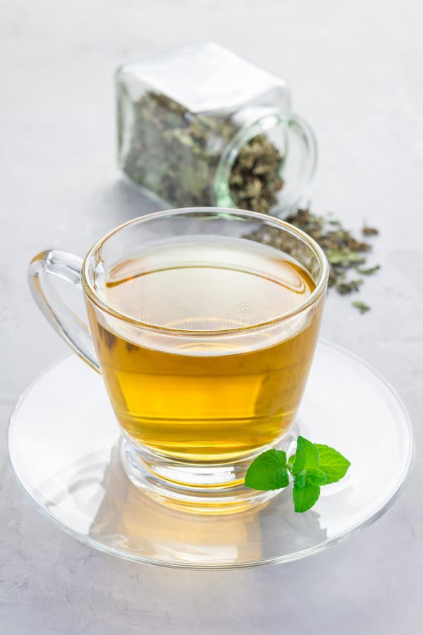 Herbal Mint Tea in a Glass Cup with Dry Peppermint Tea on Background ...