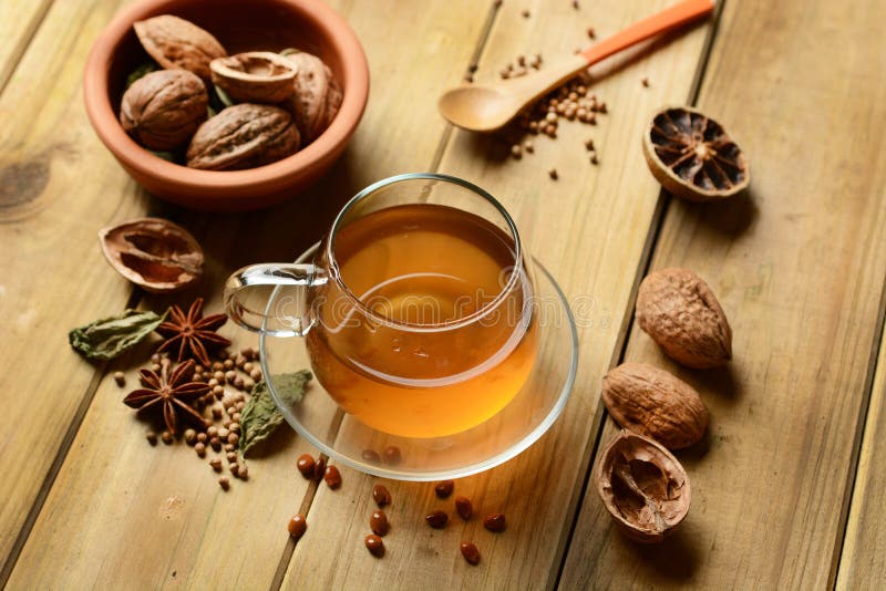 Herbal Tea with Walnuts and Ingredients Around Stock Image - Image of ...