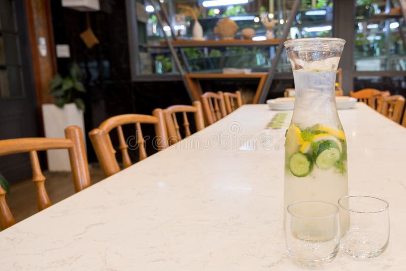 Herbal Water, Cucumber, Lemon, Mint in a Pitcher with Two Glasses on ...