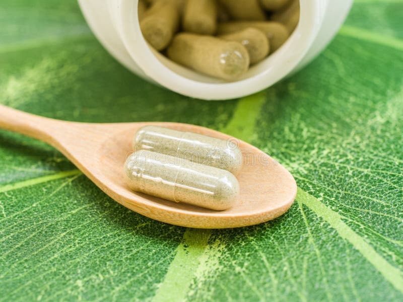 Herbs in capsules. stock image. Image of precision, druggist - 33774593