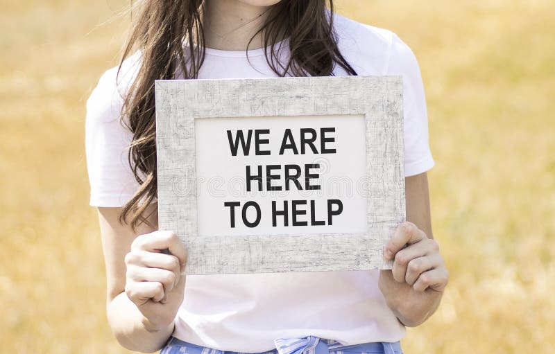 We are Here To Help Message on the Card Shown by a Woman, Business ...