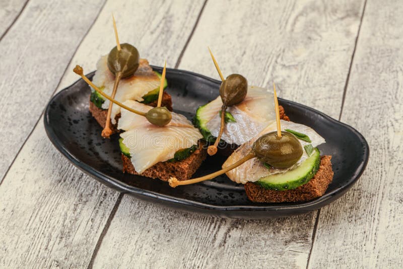 Herring Fillet Canape with Caperberry Stock Image - Image of cucumber ...