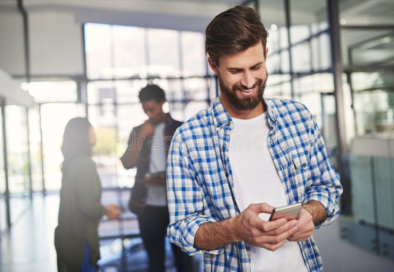 Hes always in Contact with His Clients. a Young Designer Using a ...