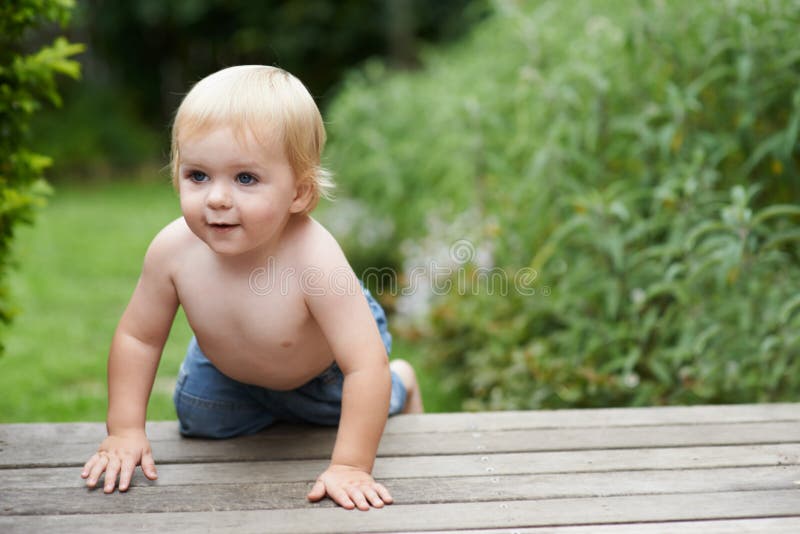 Hes a Curious Baby. a Baby Boy Crawling on the Stoop in the Backyard ...