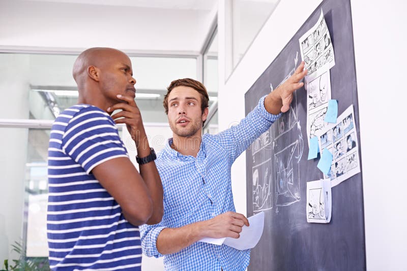 Hes Got a Solution. Two Designers Working at a Chalkboard. Stock Image ...