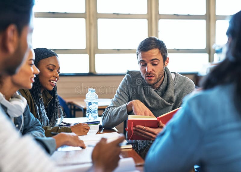 Hes Helping Them Understand. a Group of Young University Students ...