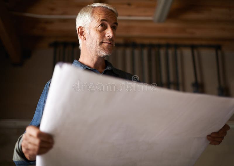 Hes a Man with a Plan. a Senior Man Holding a Blueprint. Stock Image ...