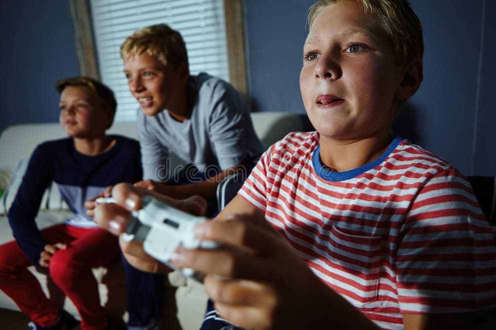 Hes a Master of the Controller. Young Boys Playing Video Games. Stock ...