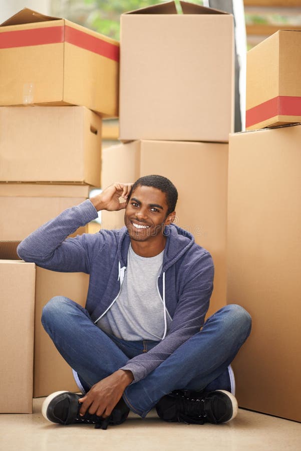 Hes Moving House. a Handsome Young Man Packing Boxes. Stock Image ...