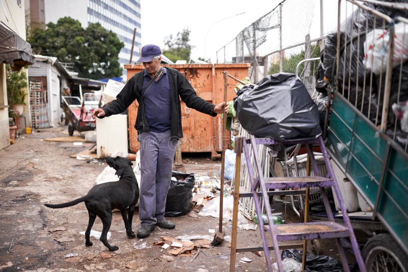 Hes My Helper and Friend. a Man Sorting through Garbage at a Dumping ...