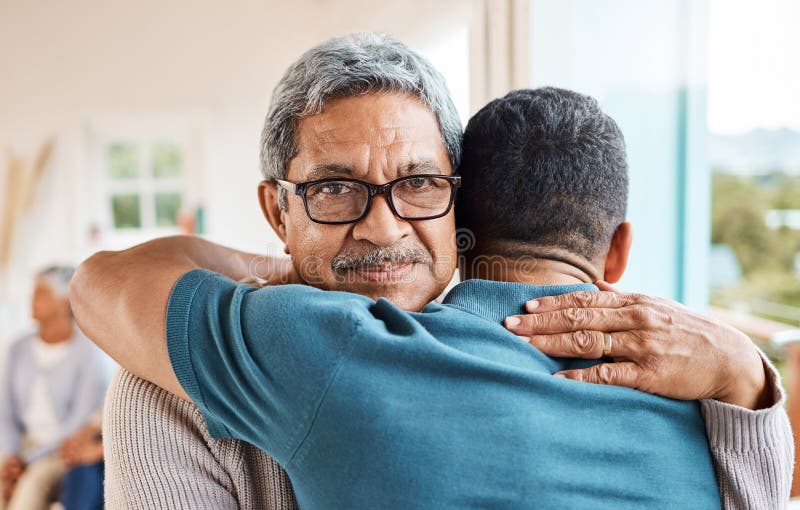 Hes Never Too Old for a Hug. a Father and Son Hugging at Home. Stock ...