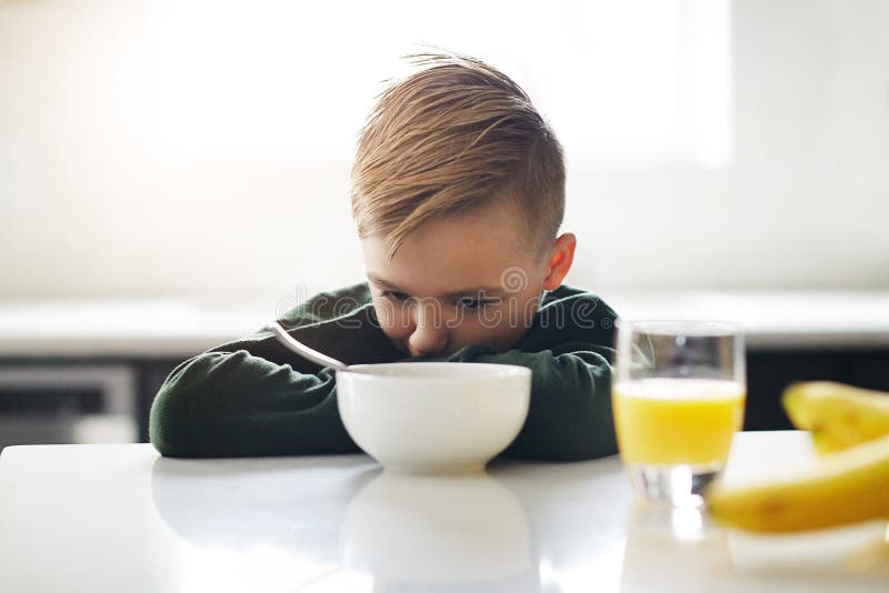 Hes Not Hungry. an Adorable Little Boy Having Breakfast while Sitting ...