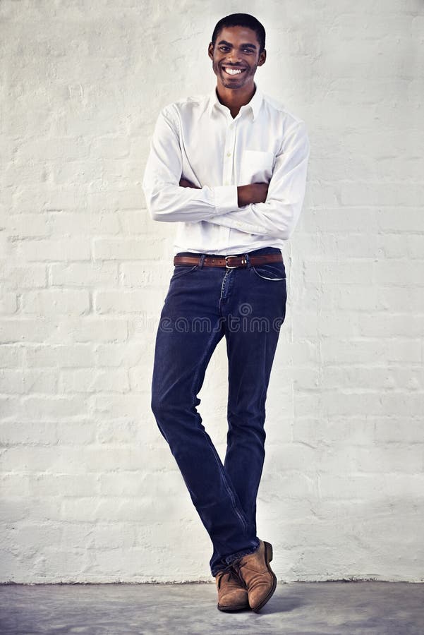 Hes One Cool Dude. a Casually Dressed Young Man Standing Against a ...